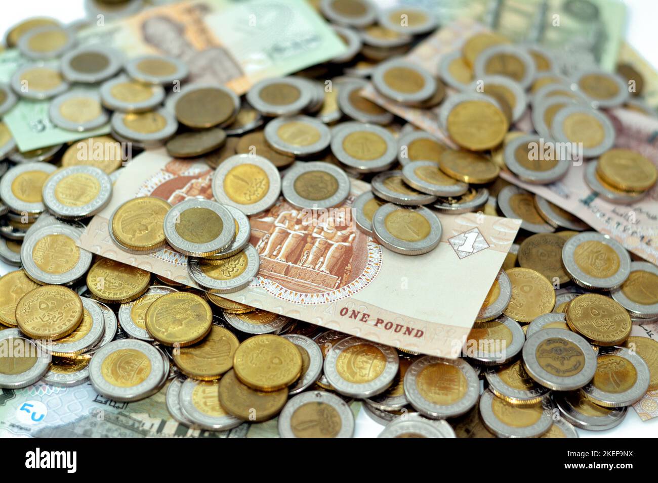pile of Egyptian money banknotes and coins of 1 EGP LE one Egyptian ...