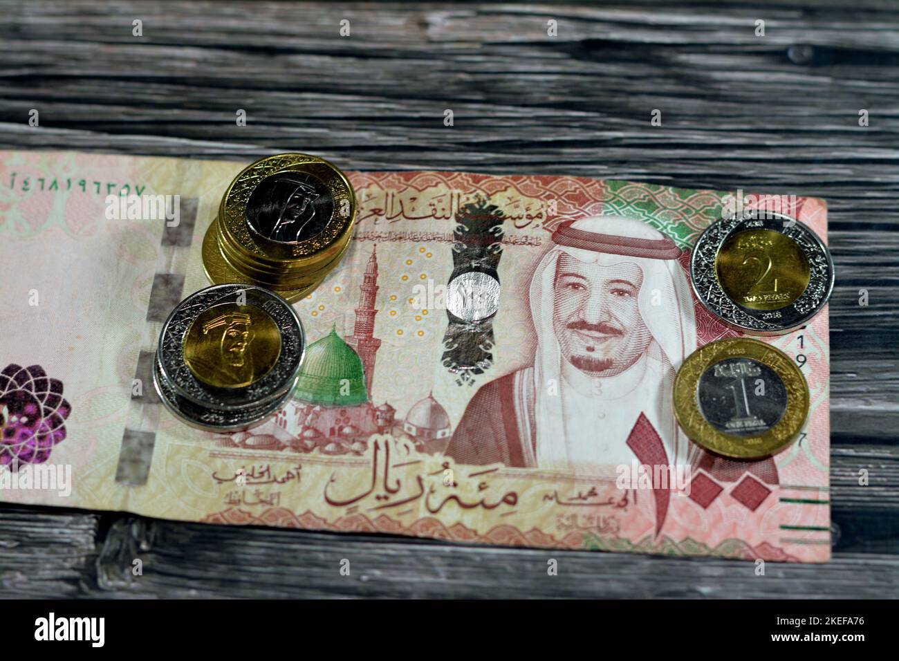 100 SAR one hundred Saudi Arabia riyals cash money banknote with pile ...