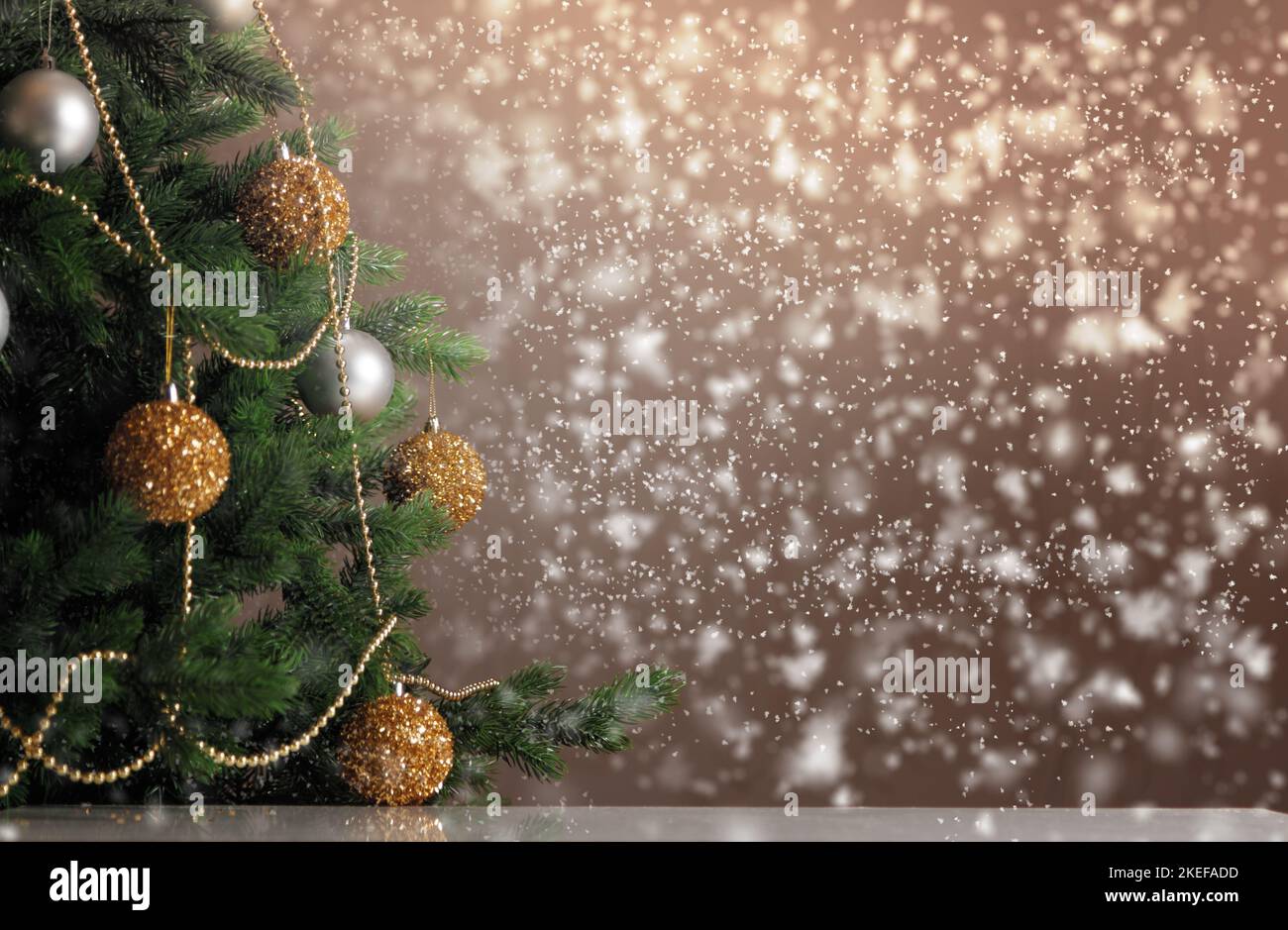 Christmas decorated tree and defocused snowfall. Holiday eve Stock ...