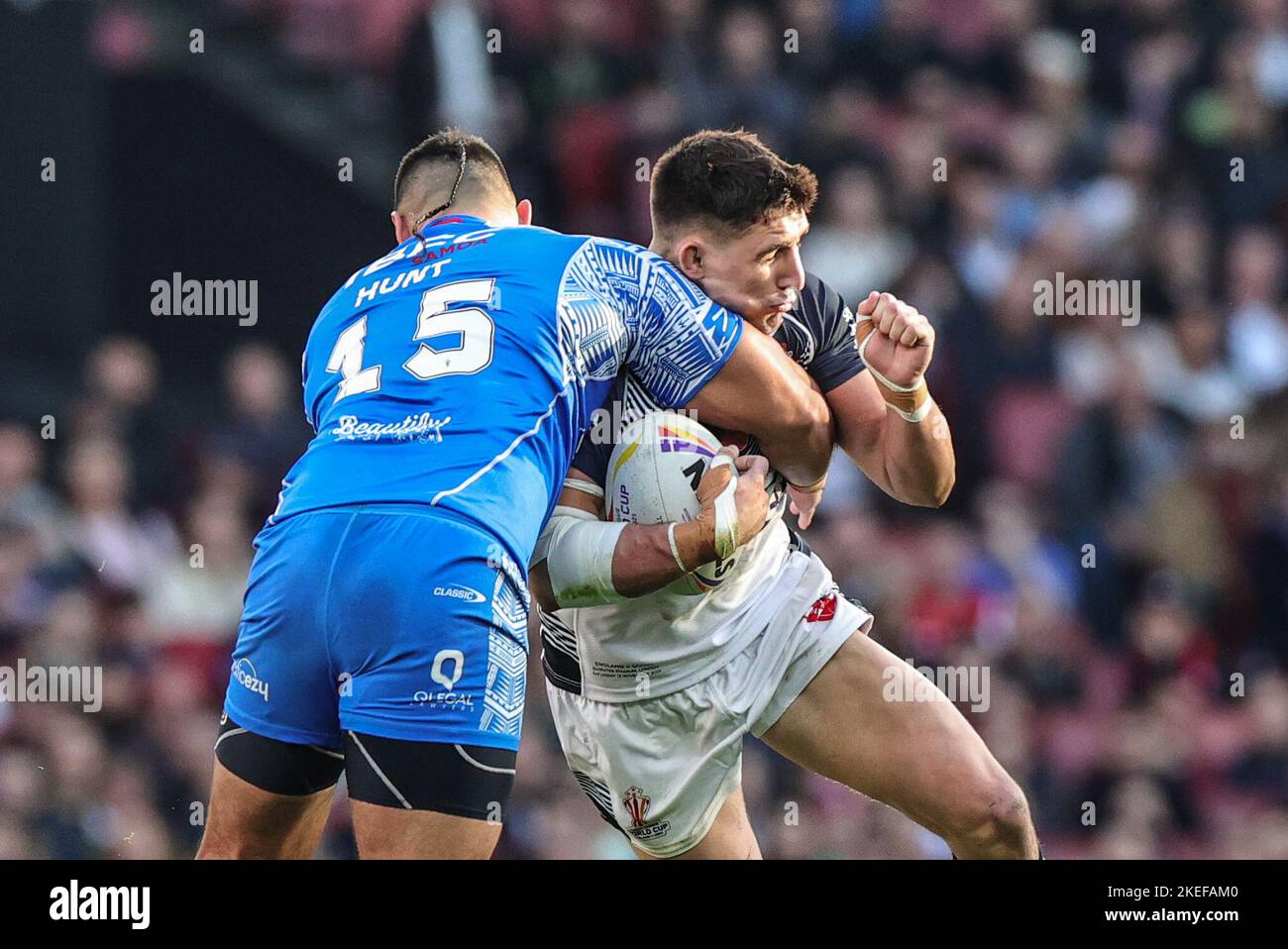 Victor Radley of England is tackled by Royce Hunt of Samoa during the ...