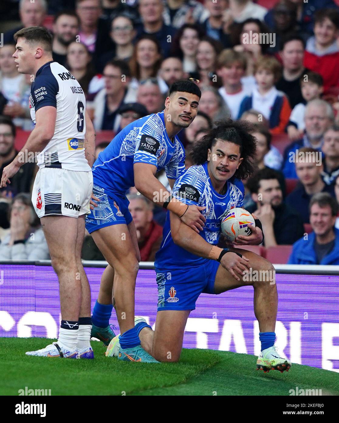 Samoa's Tim Lafai (right) celebrates scoring his sides first try during ...
