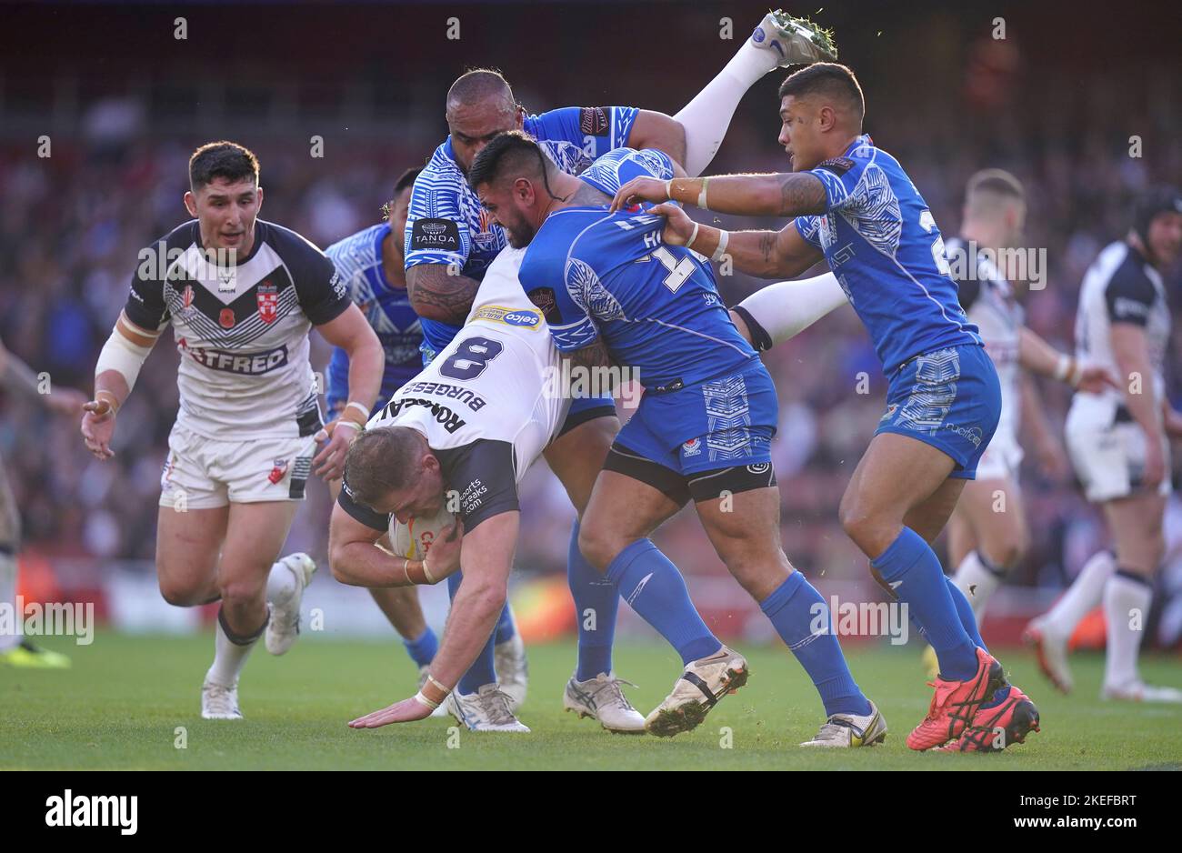 England's Thomas Burgess is tackled by Samoa's Junior Paulo during the ...