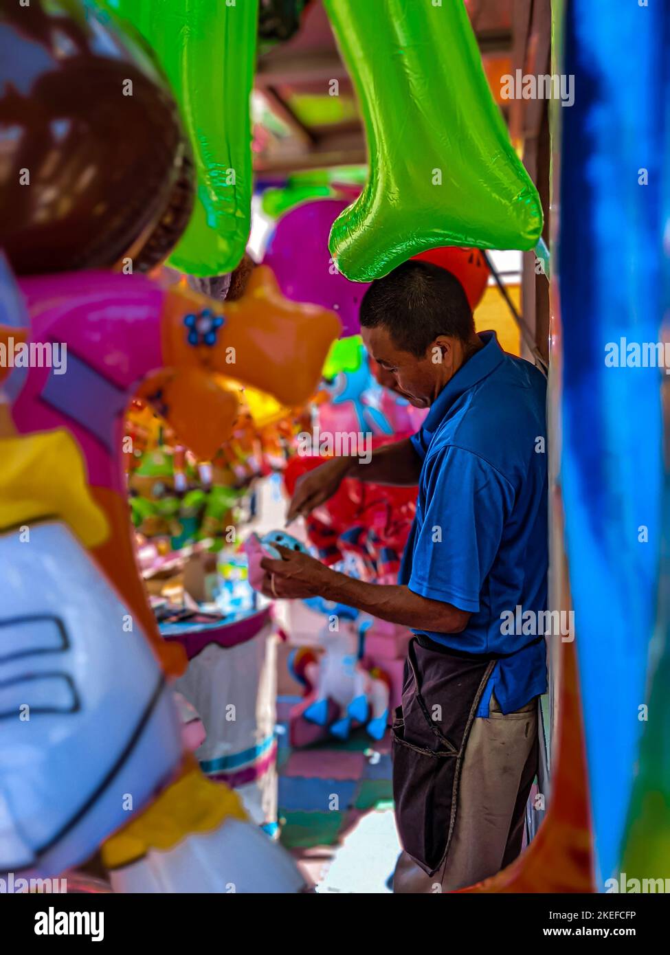 A vertical shot of a carnival worker at the Ventura County Fair Stock ...