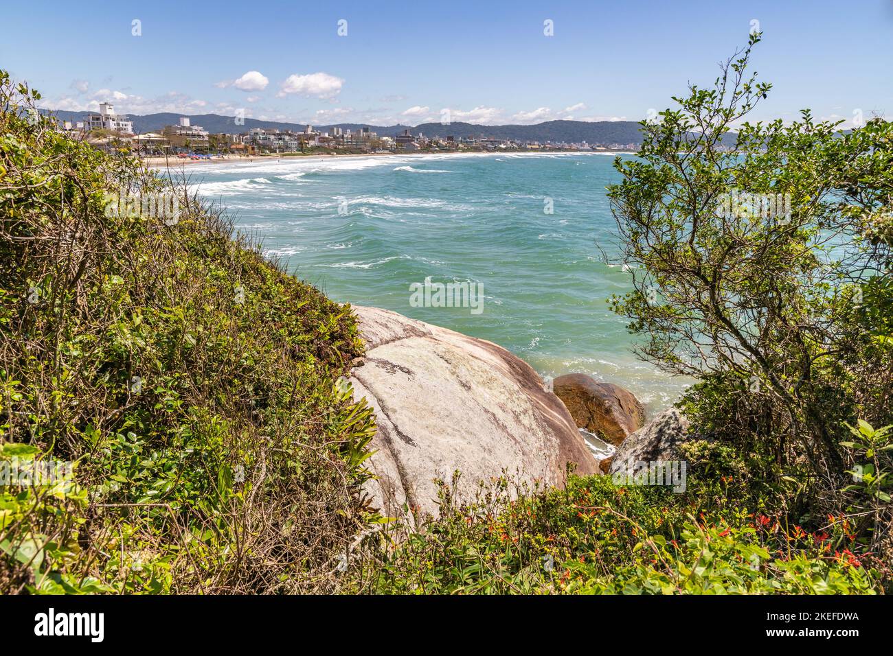 Beach view in middle of vegetation and rocks in Canto Grande beach ...