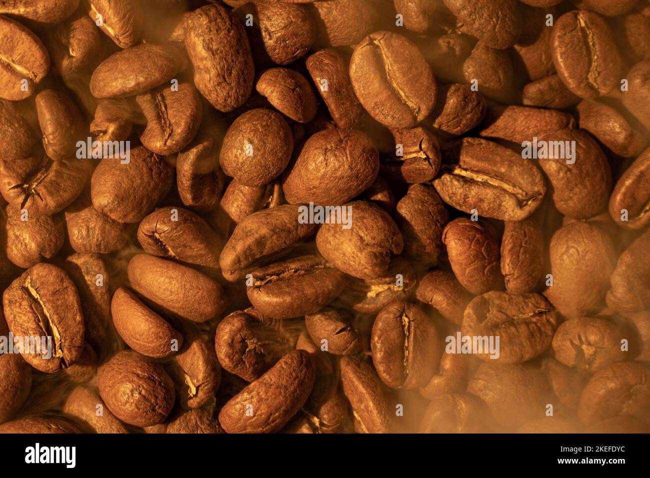 Texture of coffee beans, light soft light and steam from coffee ...