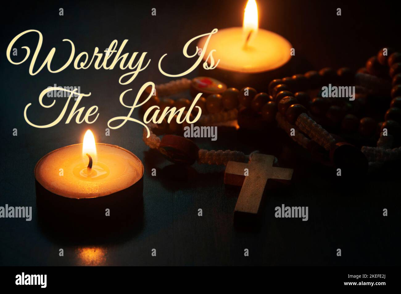 Worthy Is The Lamb text with Holy Rosary and burning candles background ...