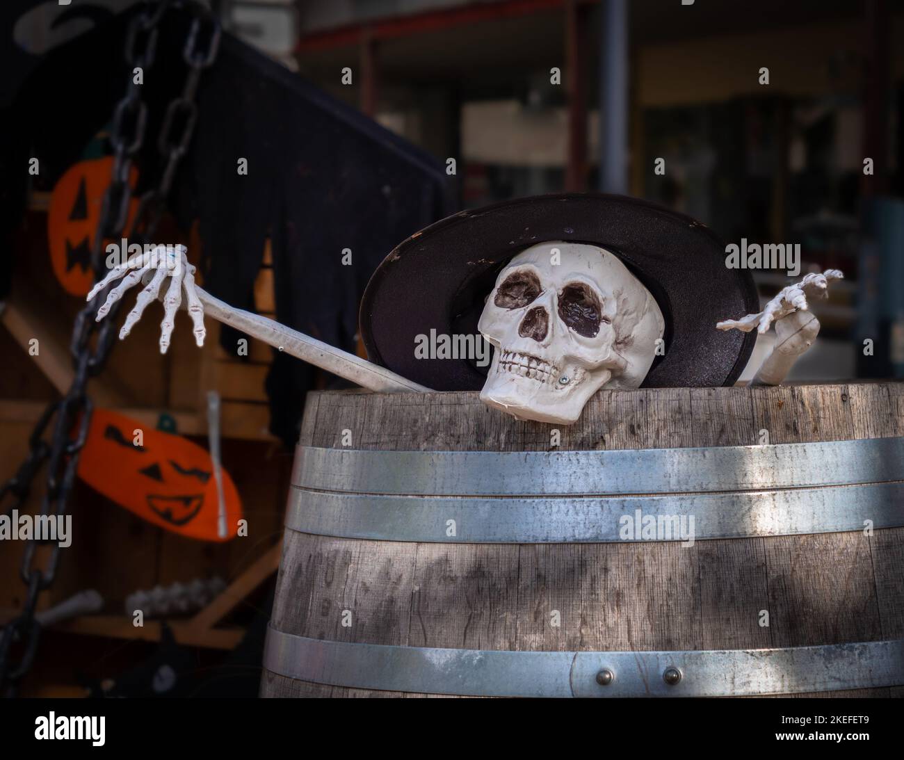 Scary scene of a skeleton looking out of a wine barrel - halloween ...