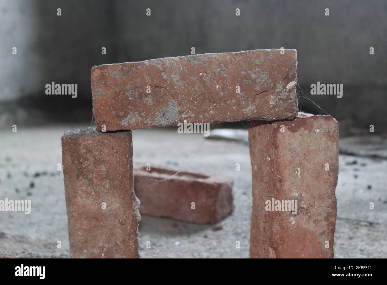 Three bricks on each other showing concept of gate Stock Photo - Alamy
