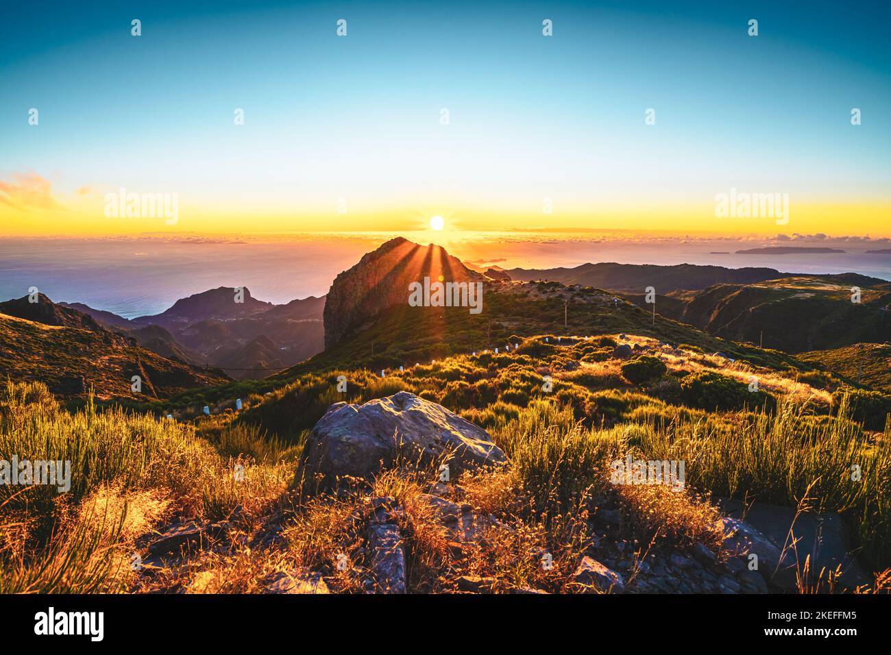 Description: Tourists watching the sunrise over the beautiful mountain ...