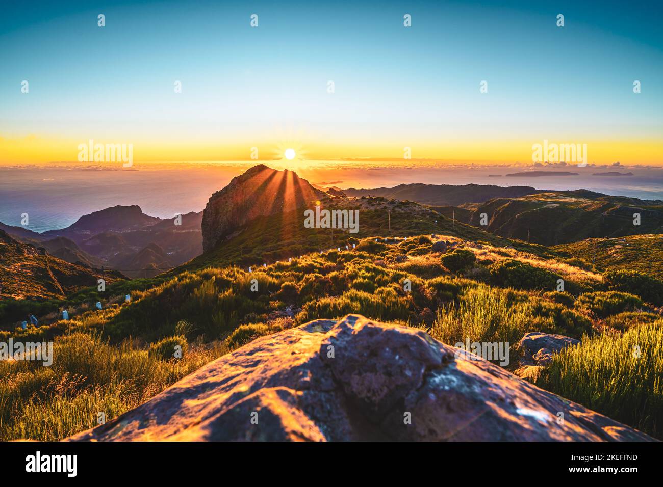 Description: Tourists watching the sunrise over the beautiful mountain ...