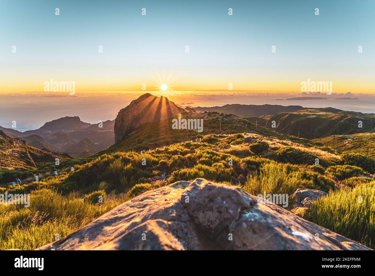 Description: Tourists watching the sunrise over the beautiful mountain ...