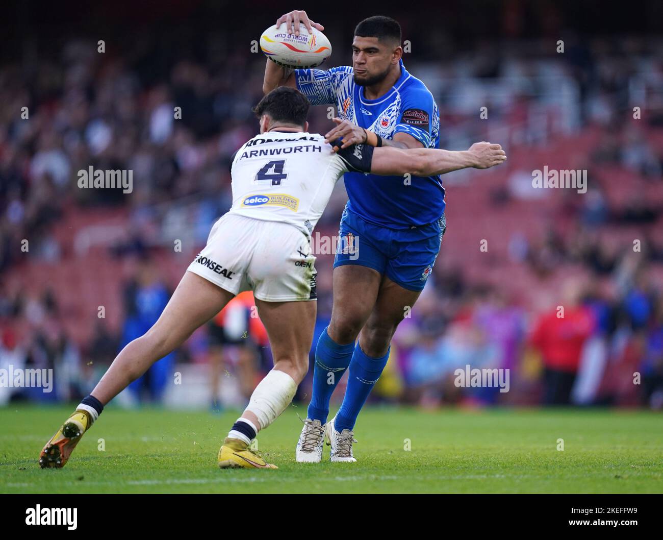 Samoa's Oregon Kaufusi is tackled by England's Herbie Farnworth during the Rugby League World ...