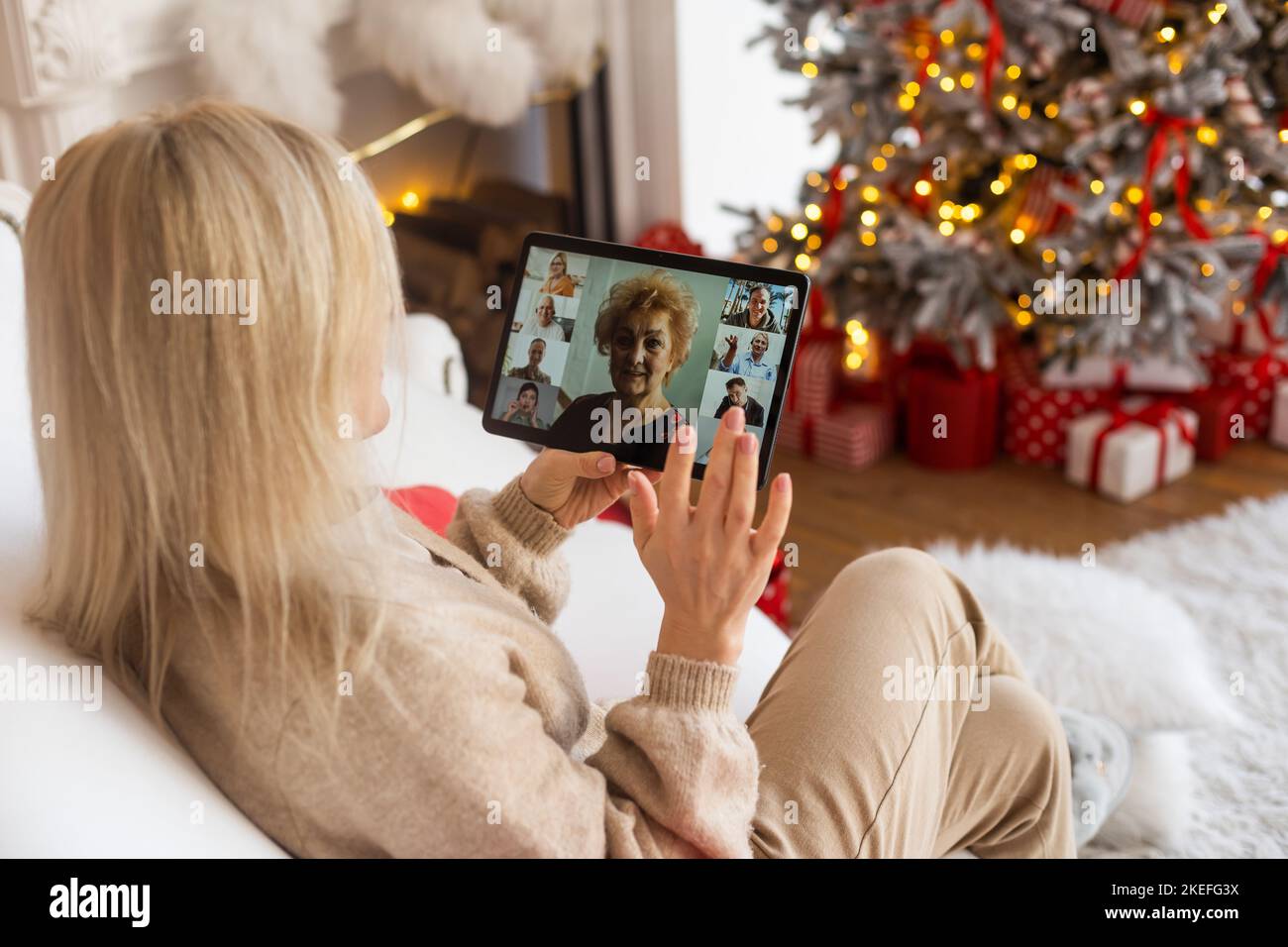 Christmas online holiday. Happy woman having video call with their ...