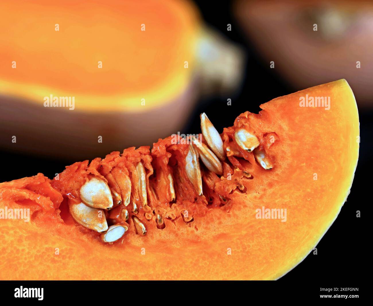 slice of butternut squash isolated on black background, healthy and ...