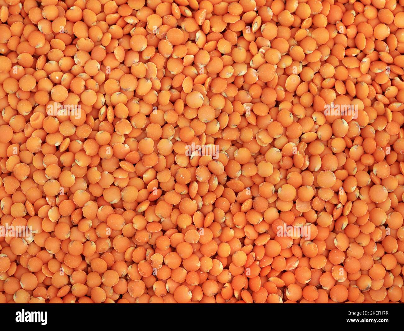 top view of raw uncooked red lentils as background, healthy vegan ...