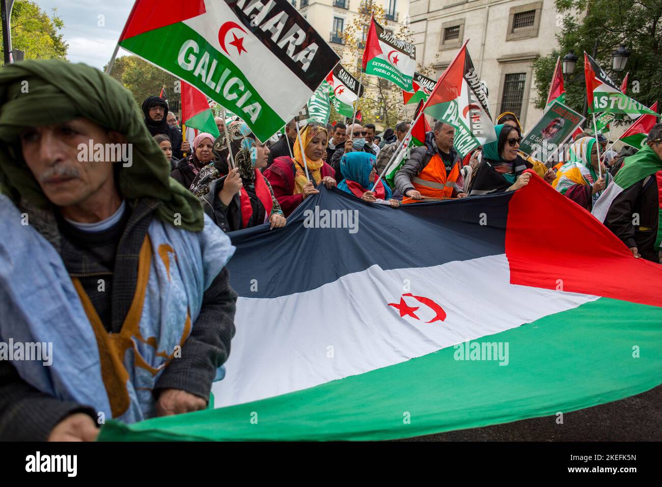 Protesters hold flags during a demonstration demanding the self ...