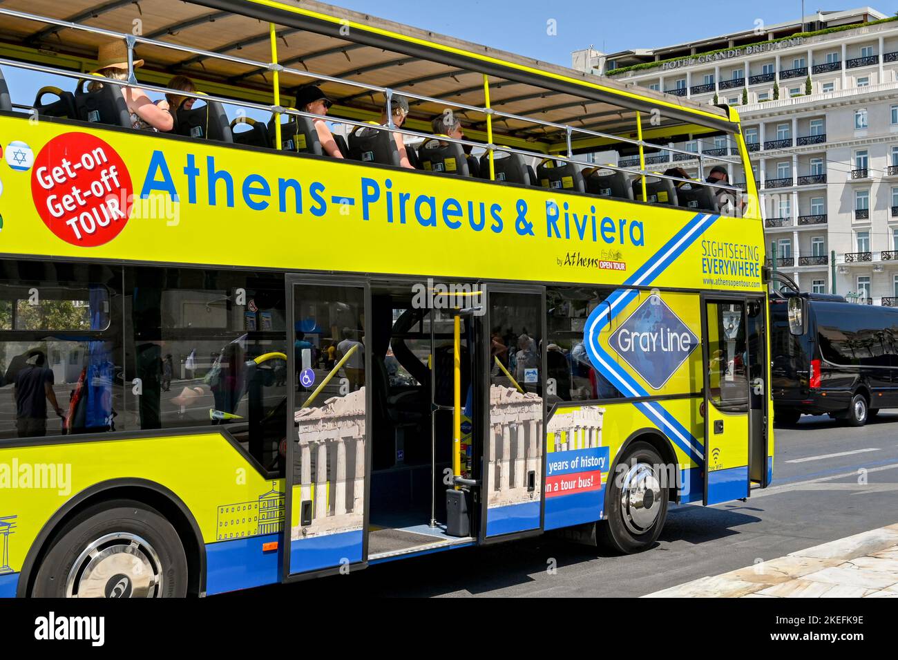 Athens, Greece - May 2022: Side view of people sitting on a hop on hop ...