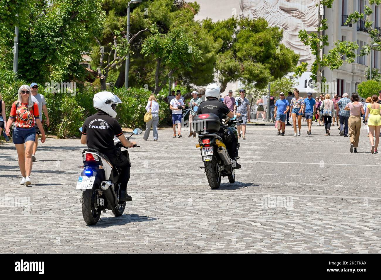 Athens, Greece - May 2022: Police officers on patrol on motorbikes in the tourist area of Athens ...