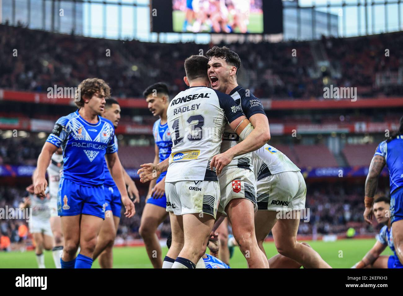 Herbie Farnworth of England celebrates their try with team mates during ...