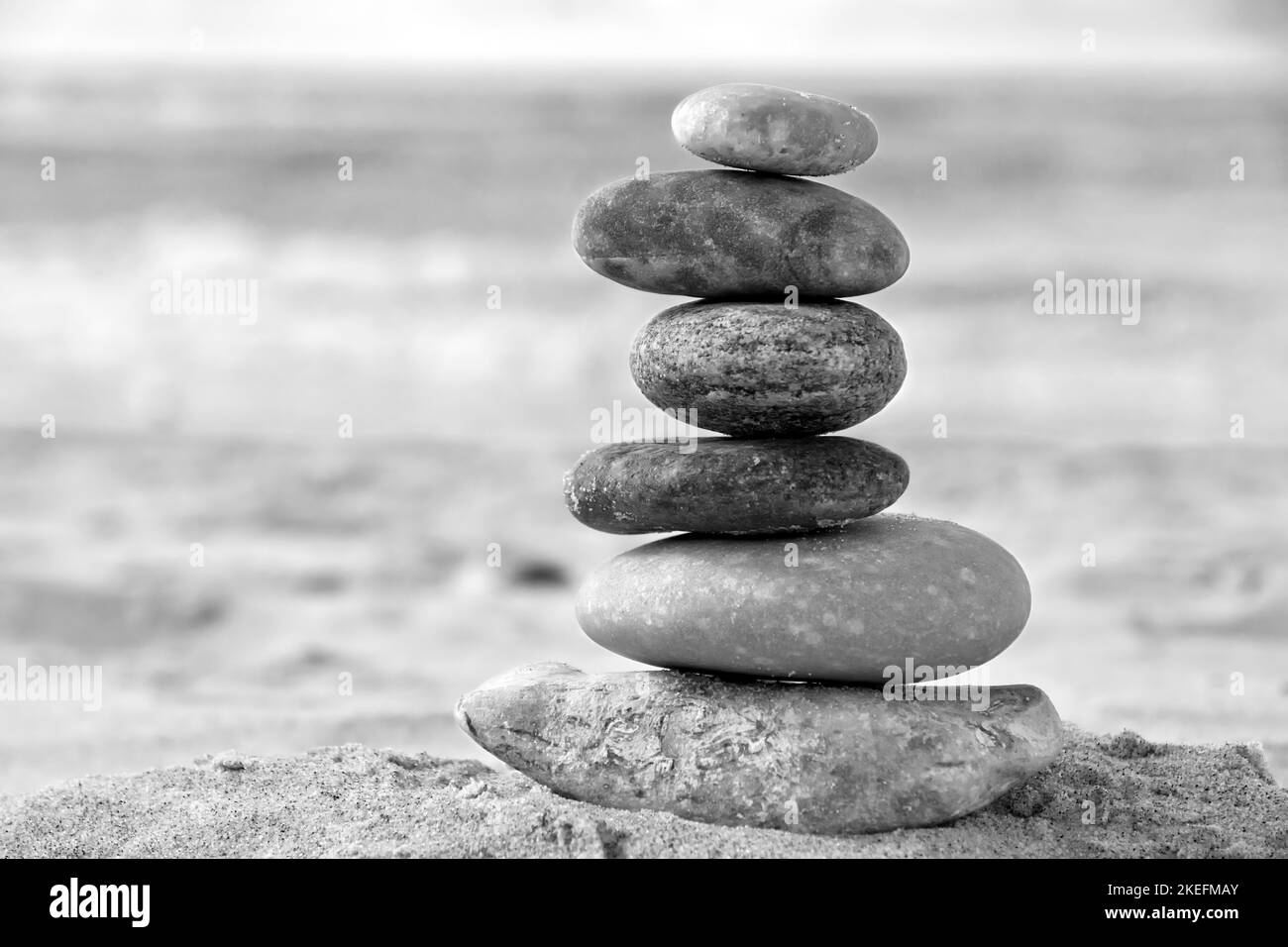 A grayscale of a pile of stones at the beach Stock Photo - Alamy