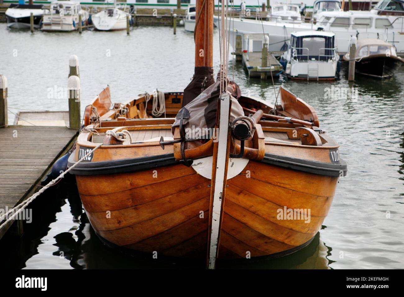 A closeup shot of a wooden brown boat moored on a pier Stock Photo - Alamy