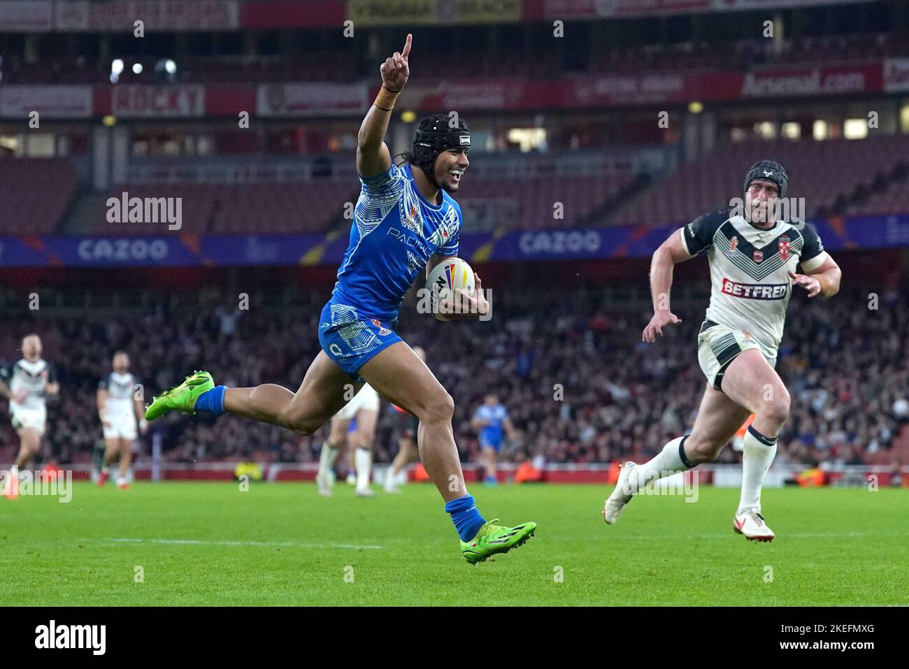 Samoa's Stephen Crichton runs in to score his sides fourth try during ...