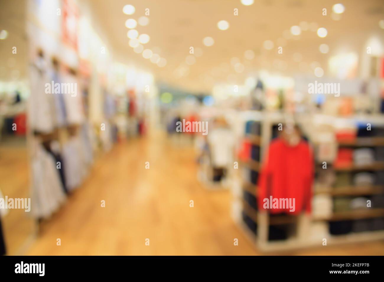 clothing boutique store interior blurred background Stock Photo - Alamy