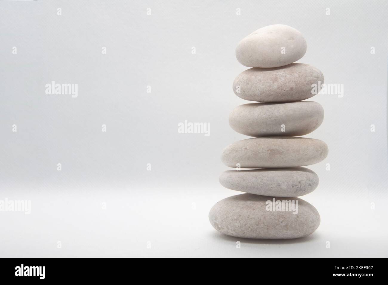Zen stones stacking on white background with customizable space for ...