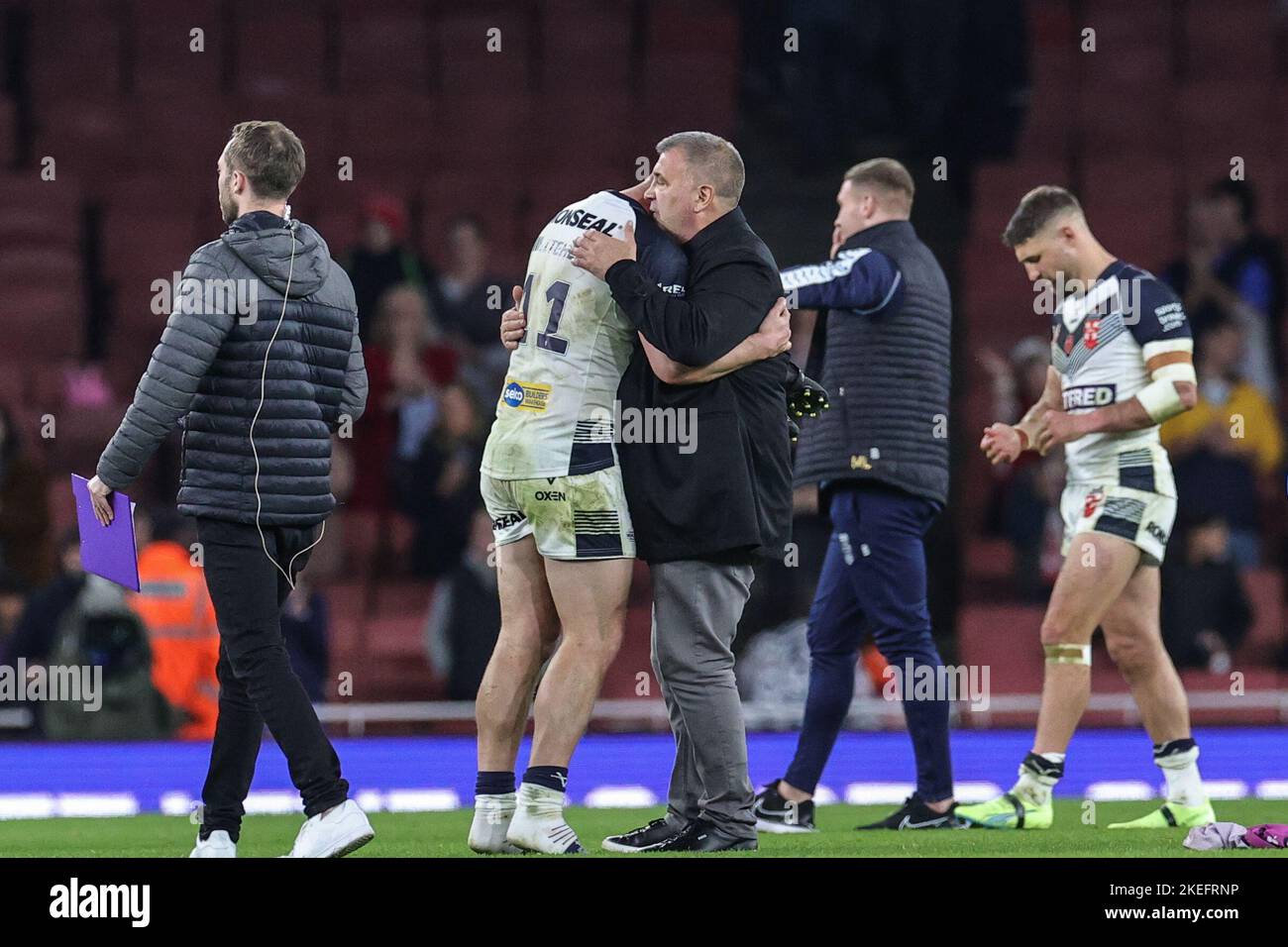 Shaun Wane Head Coach of England embraces Elliott Whitehead of England after they crash out of ...