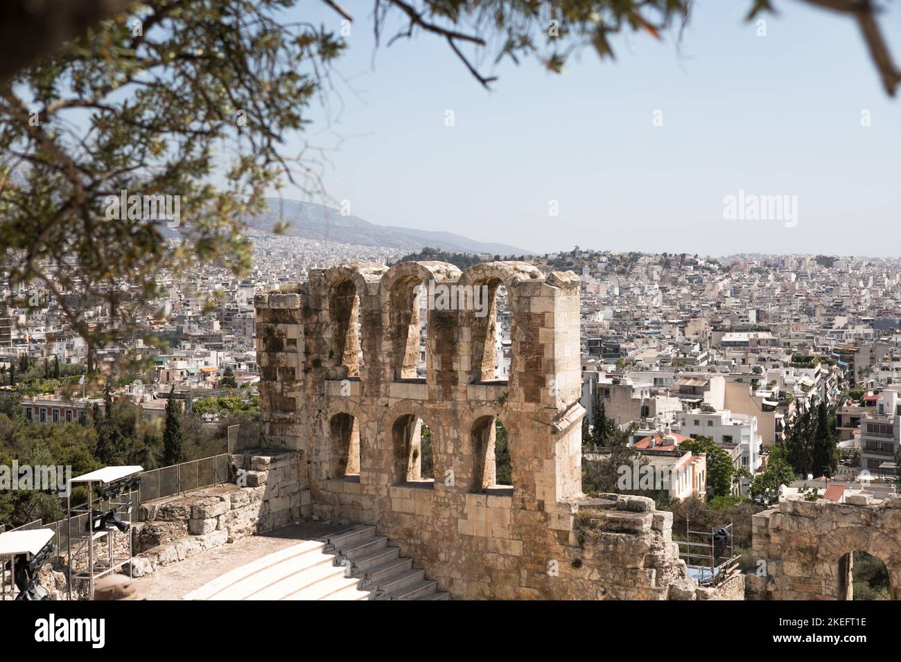 Ancient Greek ruins in Athens, Greece, Europe. Odeon of Herodes Atticus overlooking city. This ...
