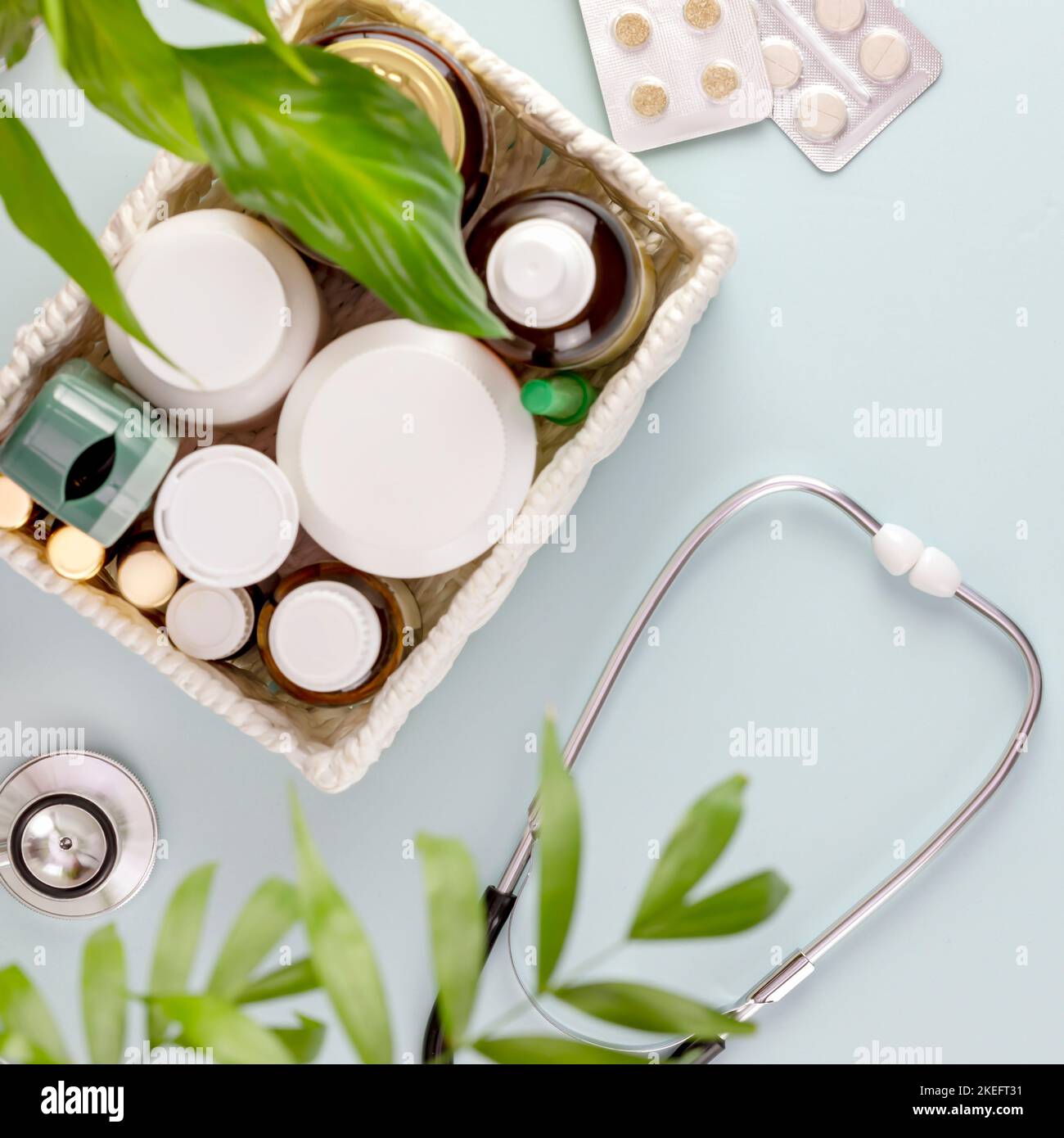 Set of medications with a stethoscope on a blue background with home ...