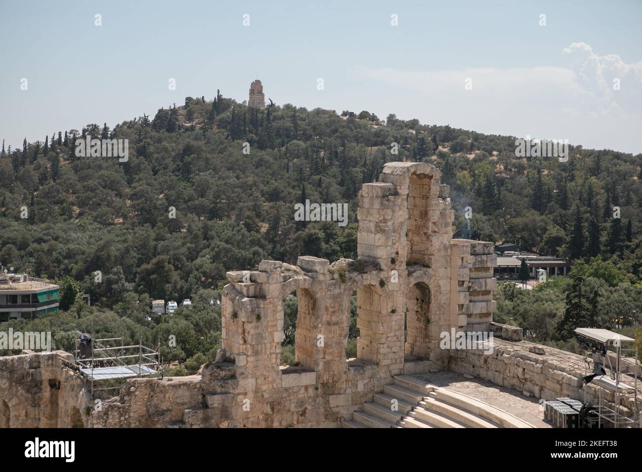 Ancient Greek ruins in Athens, Greece, Europe. Odeon of Herodes Atticus overlooking city. This ...