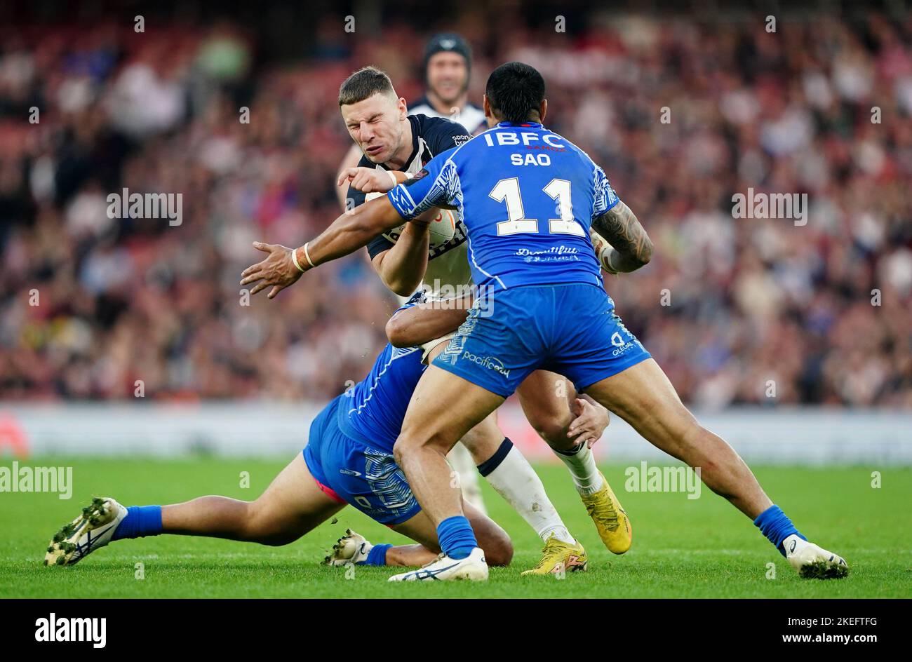 England's George Williams is tackled by Samoa's Ligi Sao during the ...