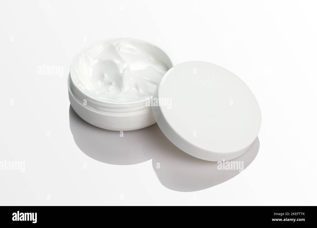 Blank Cosmetic Cream Pack Mockup on white reflective background Stock ...