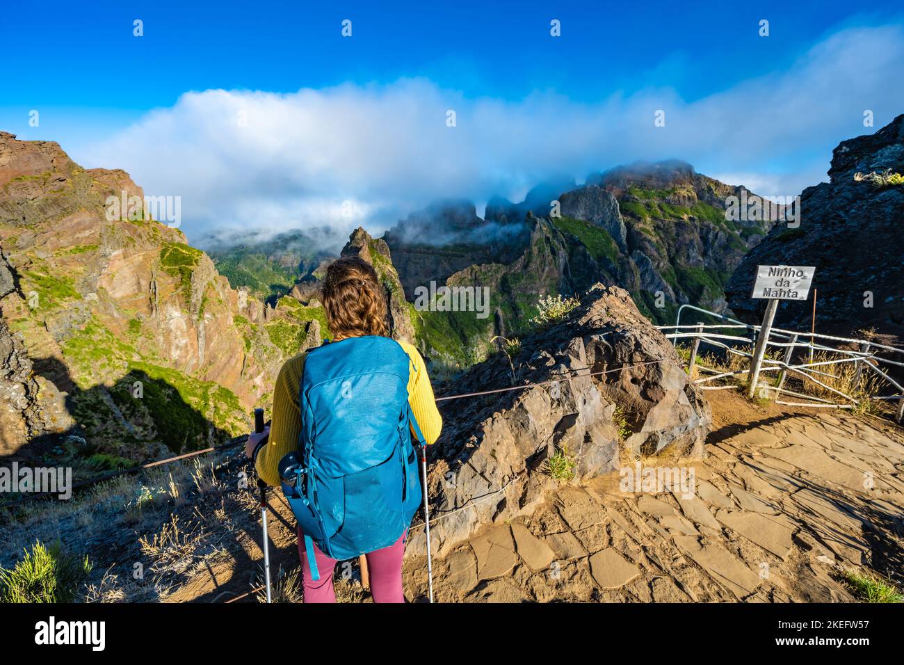 Description: Hiker enjoying the mountain scenery of Pico Ruivo from a ...
