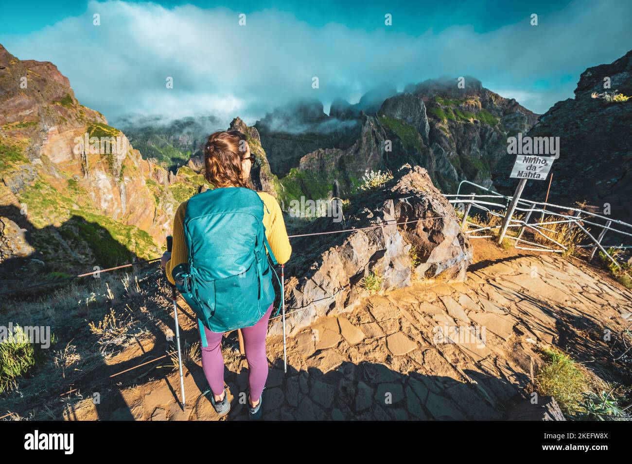 Description: Hiker enjoying the mountain scenery of Pico Ruivo from a ...