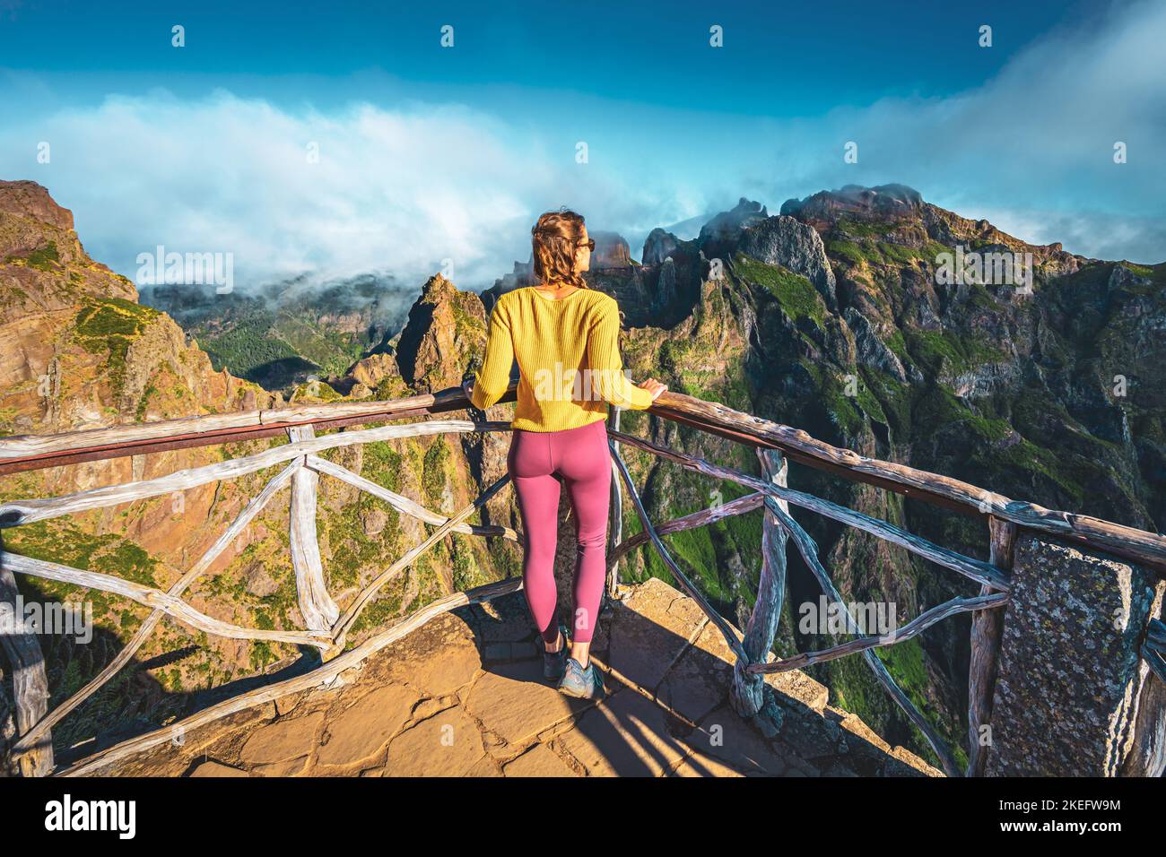 Description: Hiker enjoying the mountain scenery of Pico Ruivo from a ...