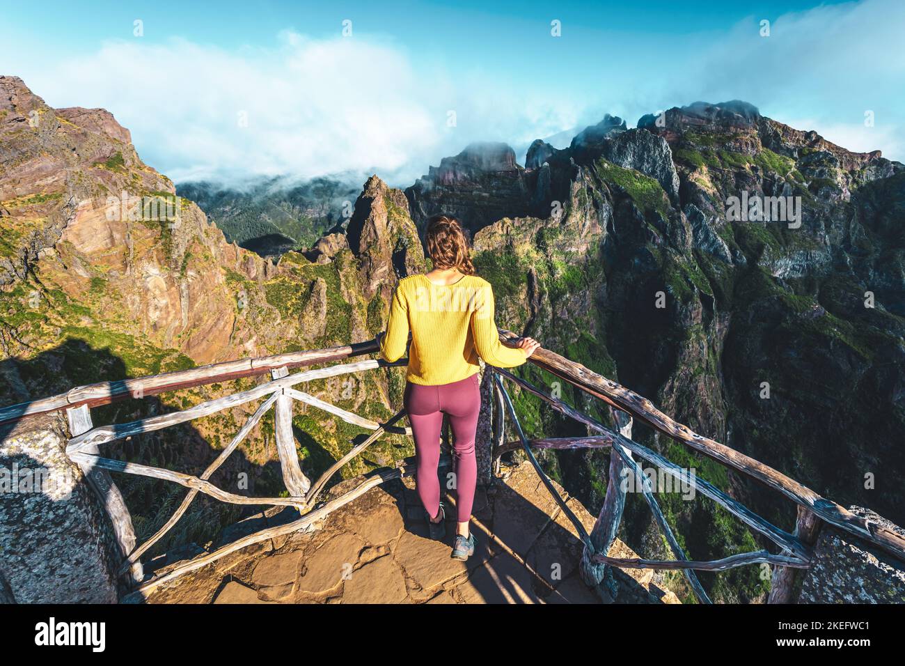 Description: Hiker enjoying the mountain scenery of Pico Ruivo from a ...