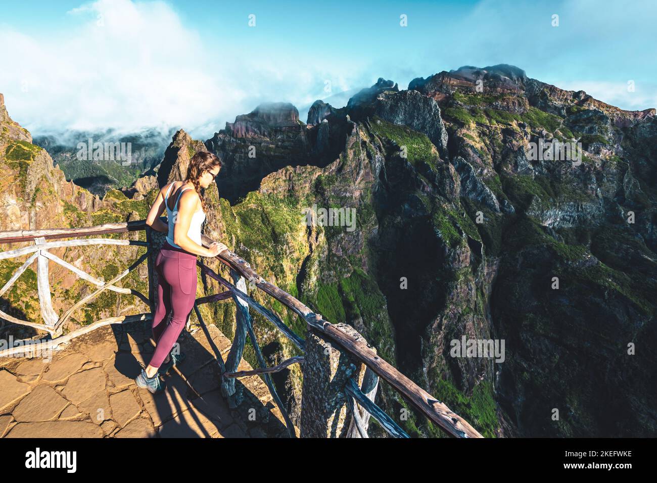 Description: Hiker enjoying the mountain scenery of Pico Ruivo from a ...