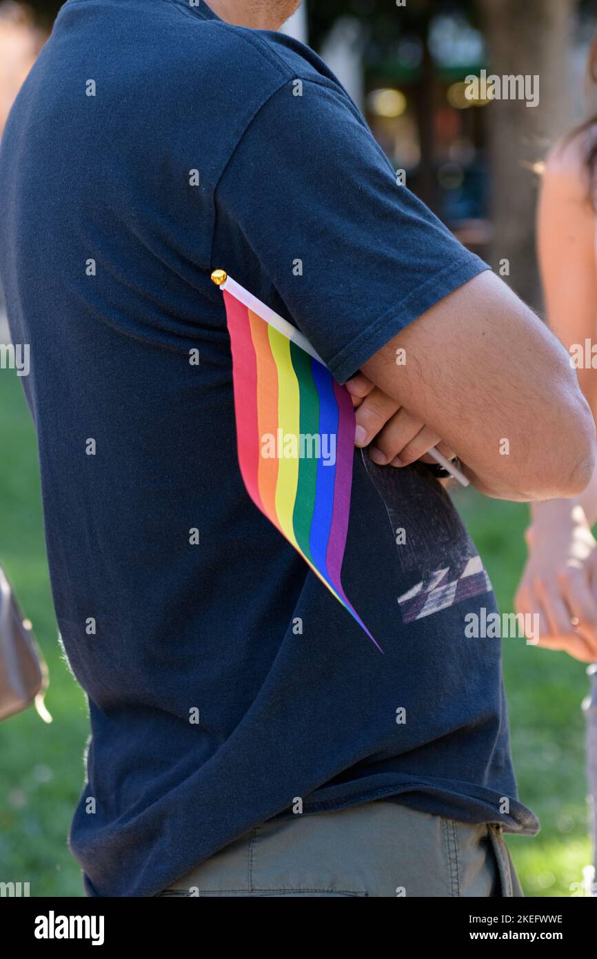 Mans Hand Holding Lgbt Rainbow Flag During Gay Pride Selective Focus