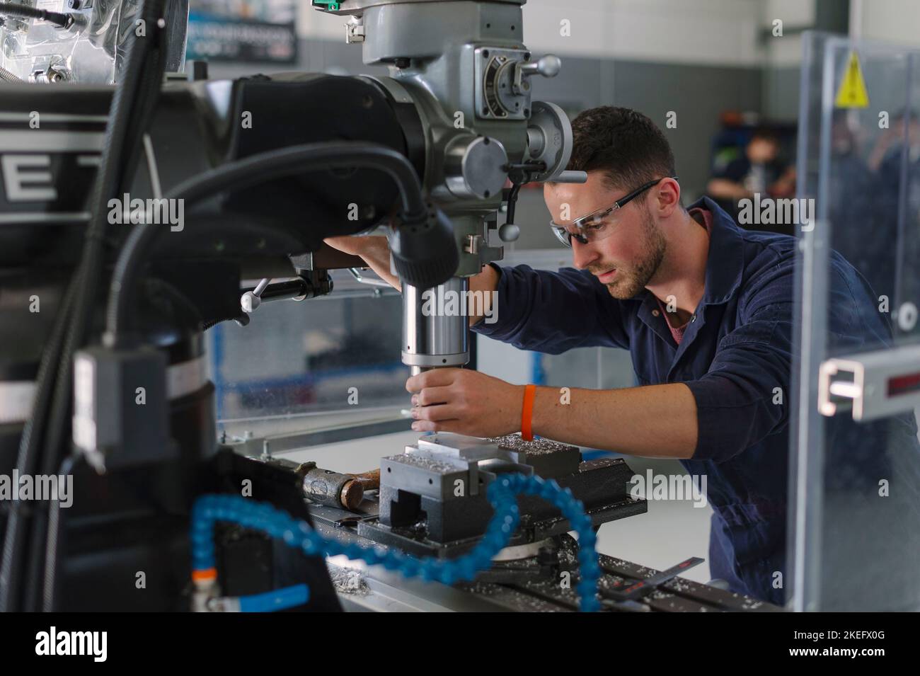 An Engineering student using tools in an engineering centre, college ...