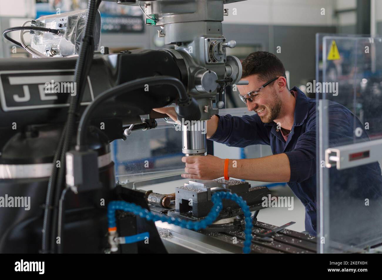 An Engineering student using tools in an engineering centre, college ...