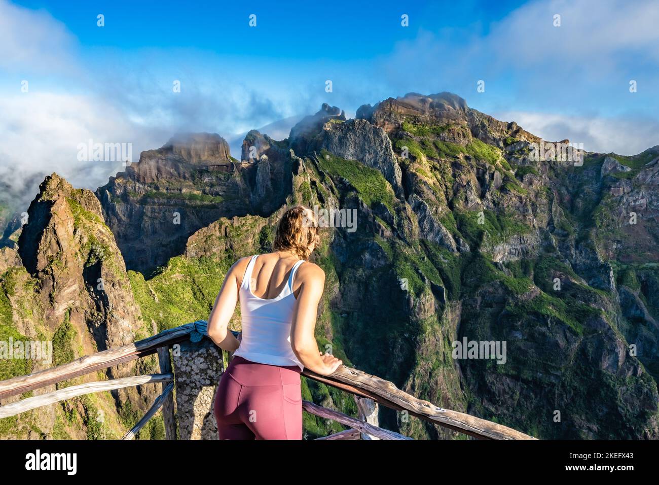Description: Hiker enjoying the mountain scenery of Pico Ruivo from a ...