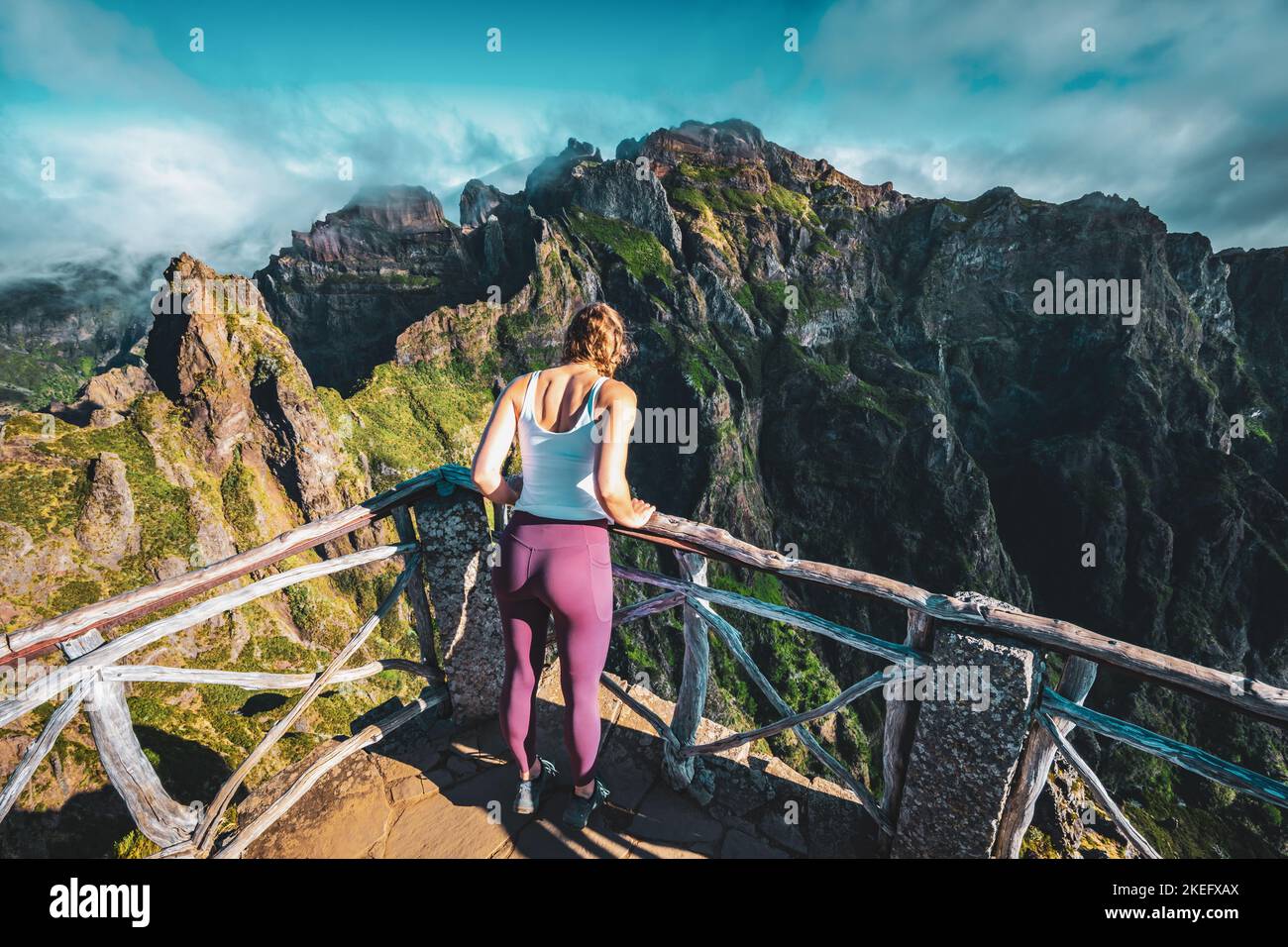 Description: Hiker enjoying the mountain scenery of Pico Ruivo from a ...