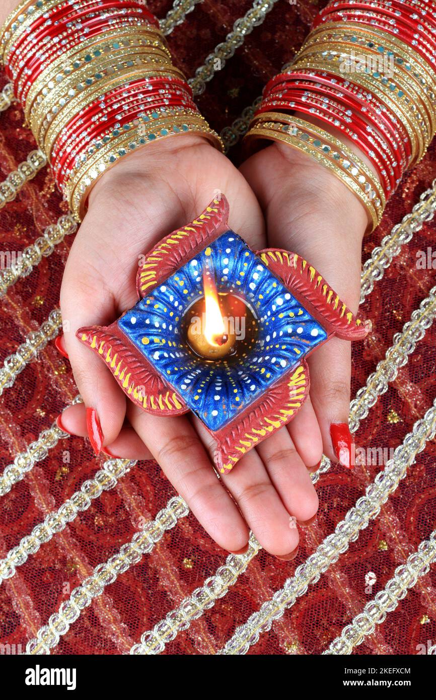 Indian female with diya hi-res stock photography and images - Alamy