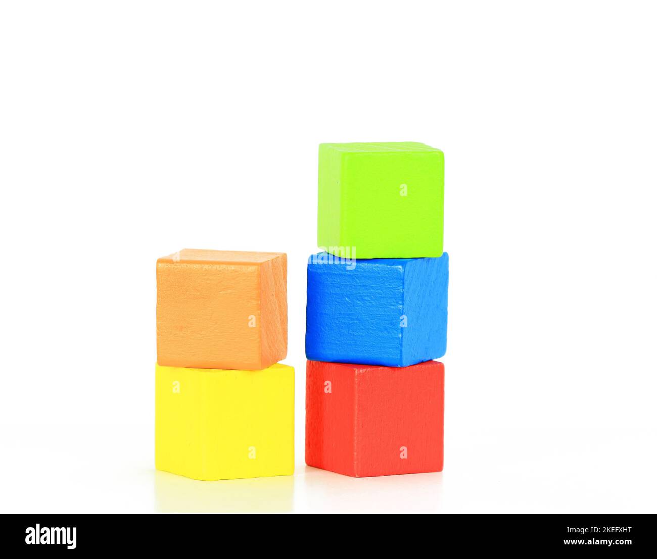 A closeup of colorful wooden blocks for children on a white background ...