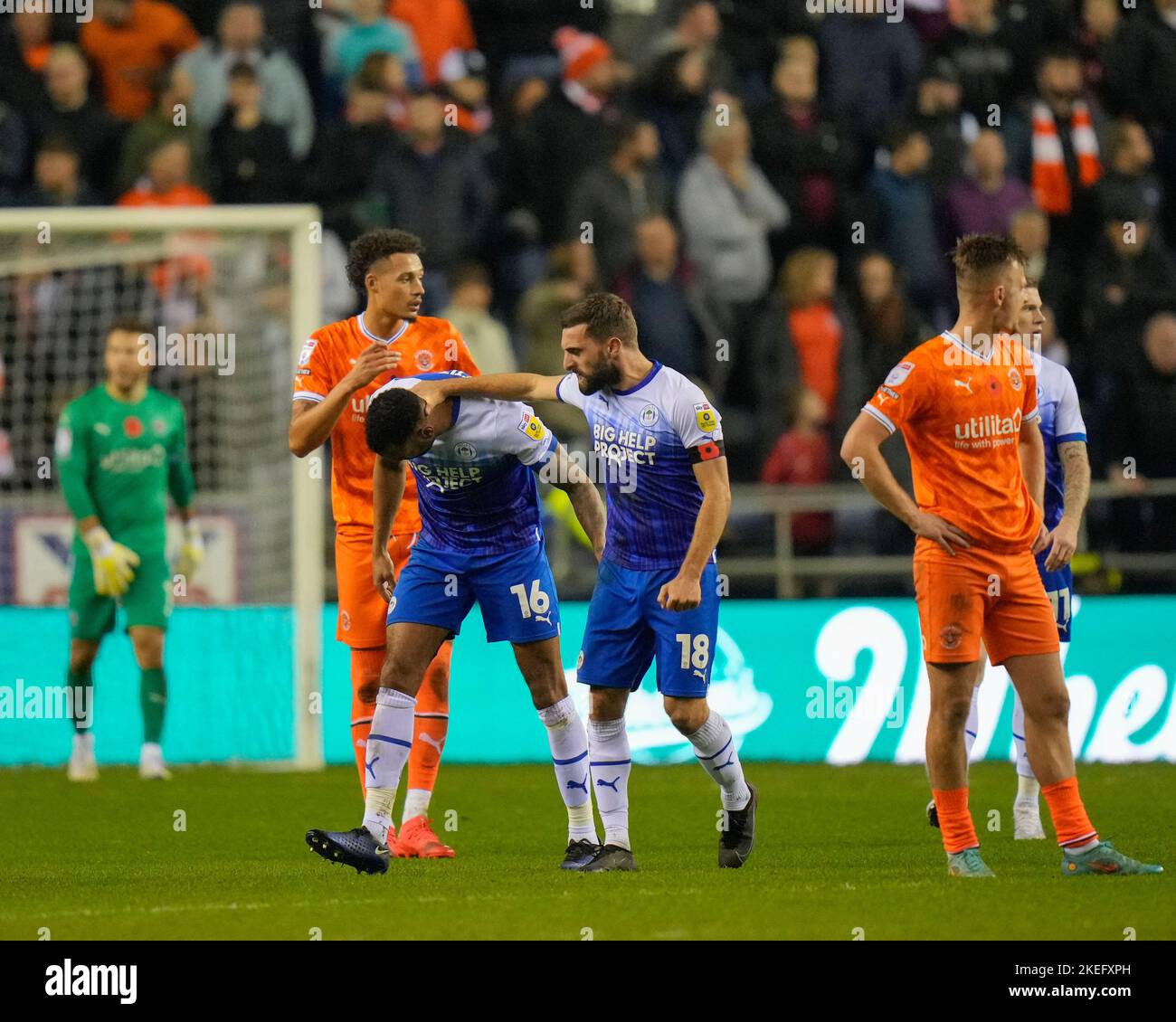 Graeme Shinnie #18 congratulates Curtis Tilt of Wigan Athletic after ...