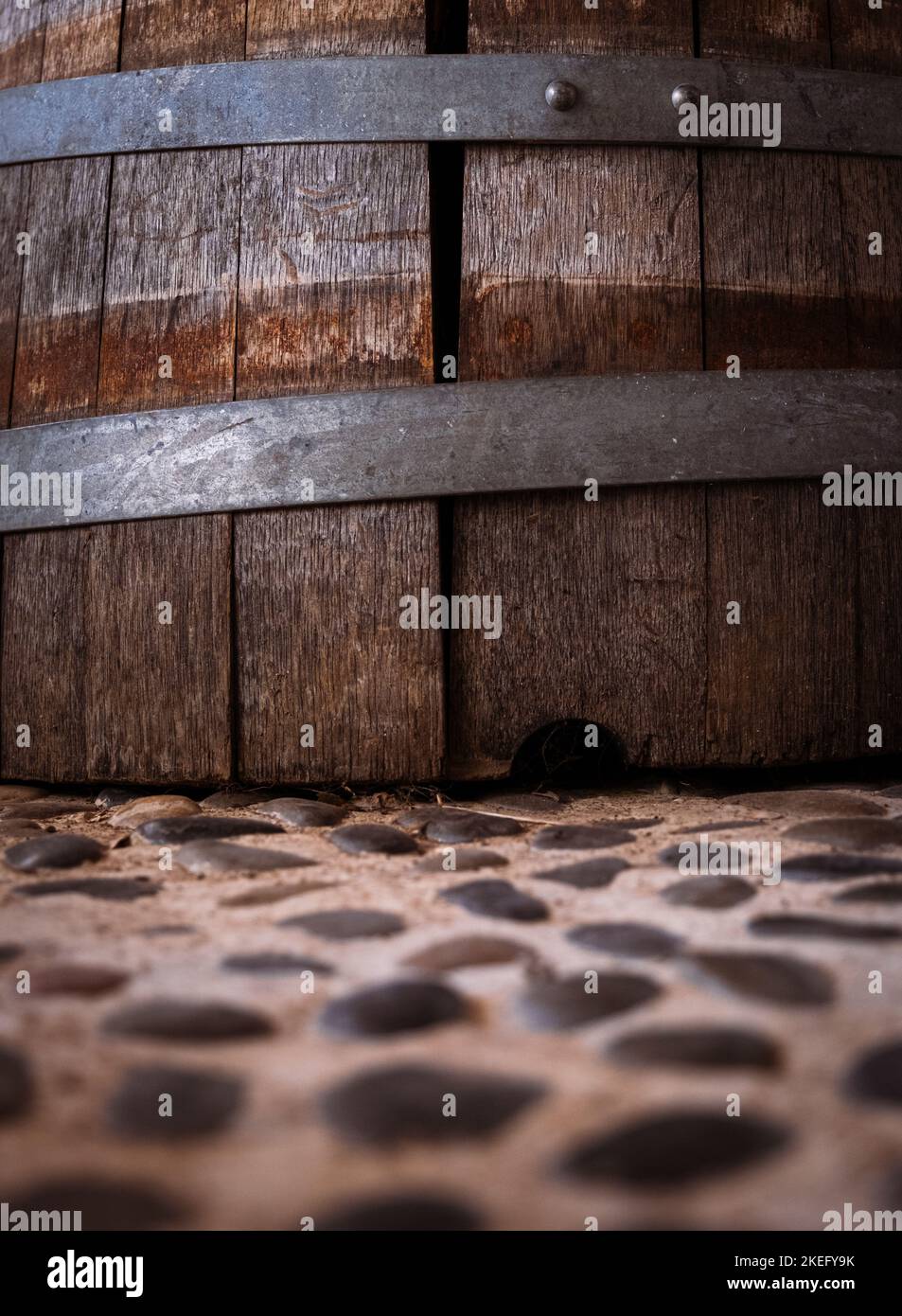 A vertical closeup shot of old wooden rusty wine barrels Stock Photo ...