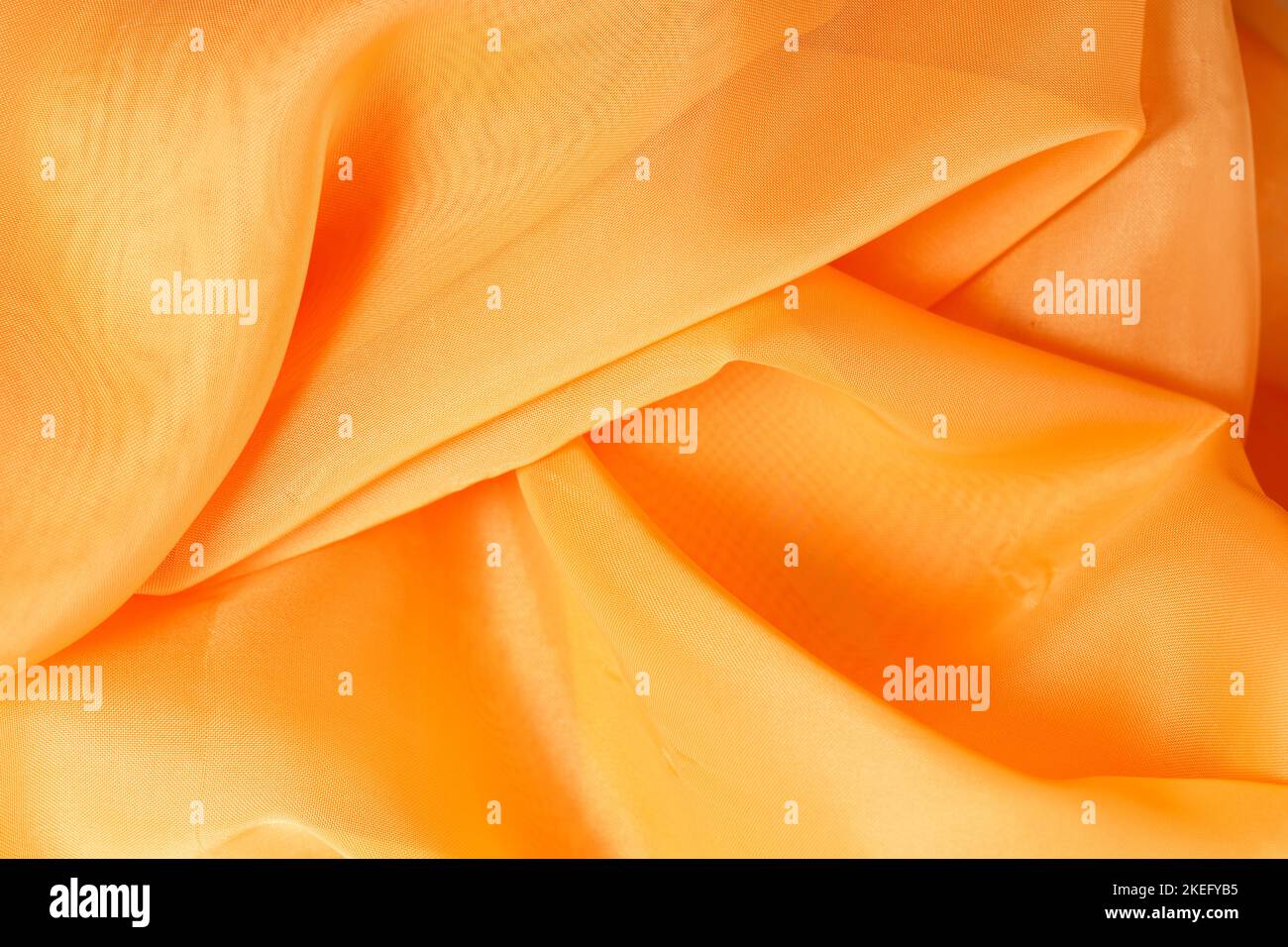 orange silk fabric. fabric texture wavy. High quality photo Stock Photo ...
