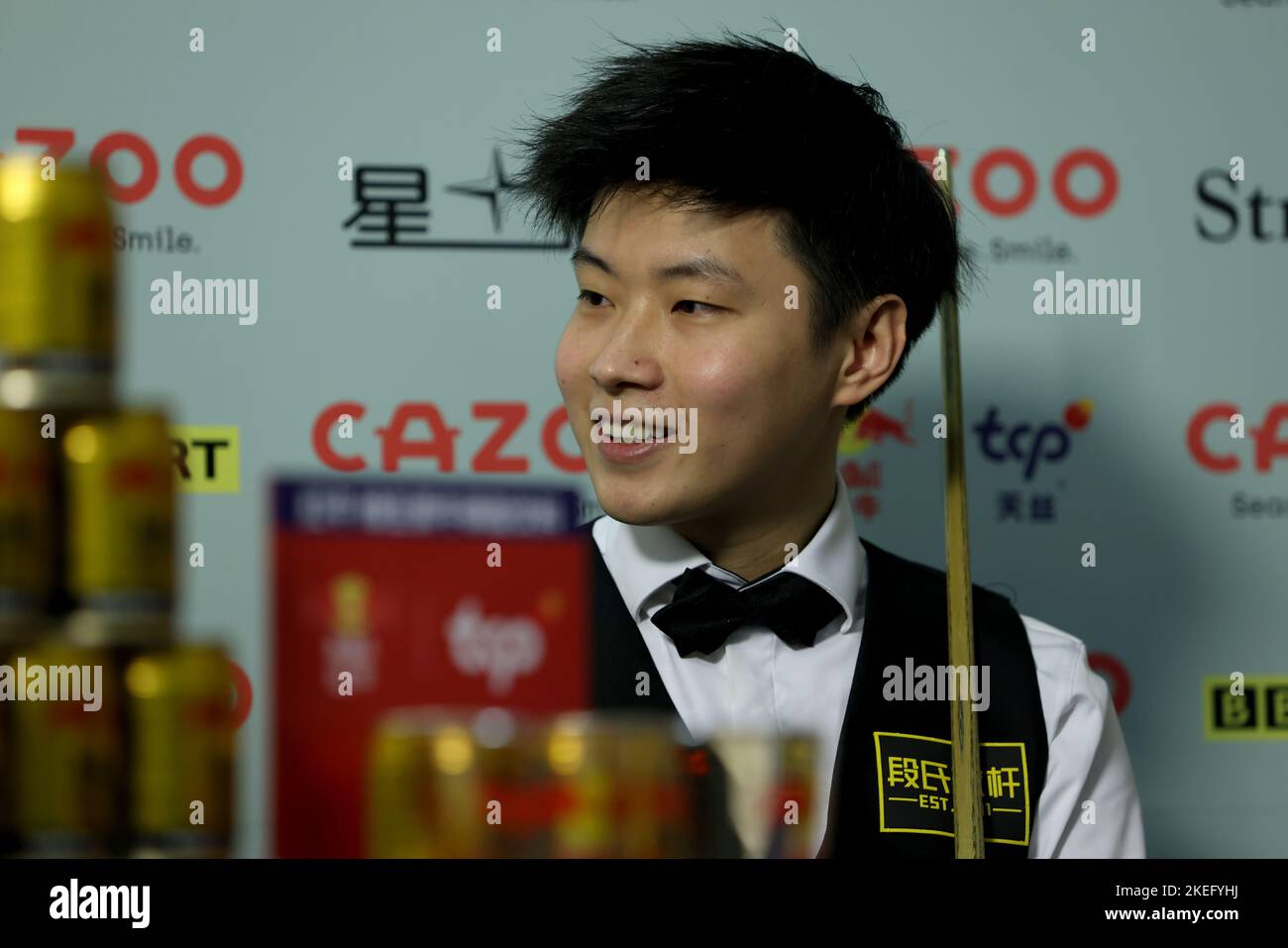 China’s Zhao Xintong looks on as he is interviewed following his loss ...